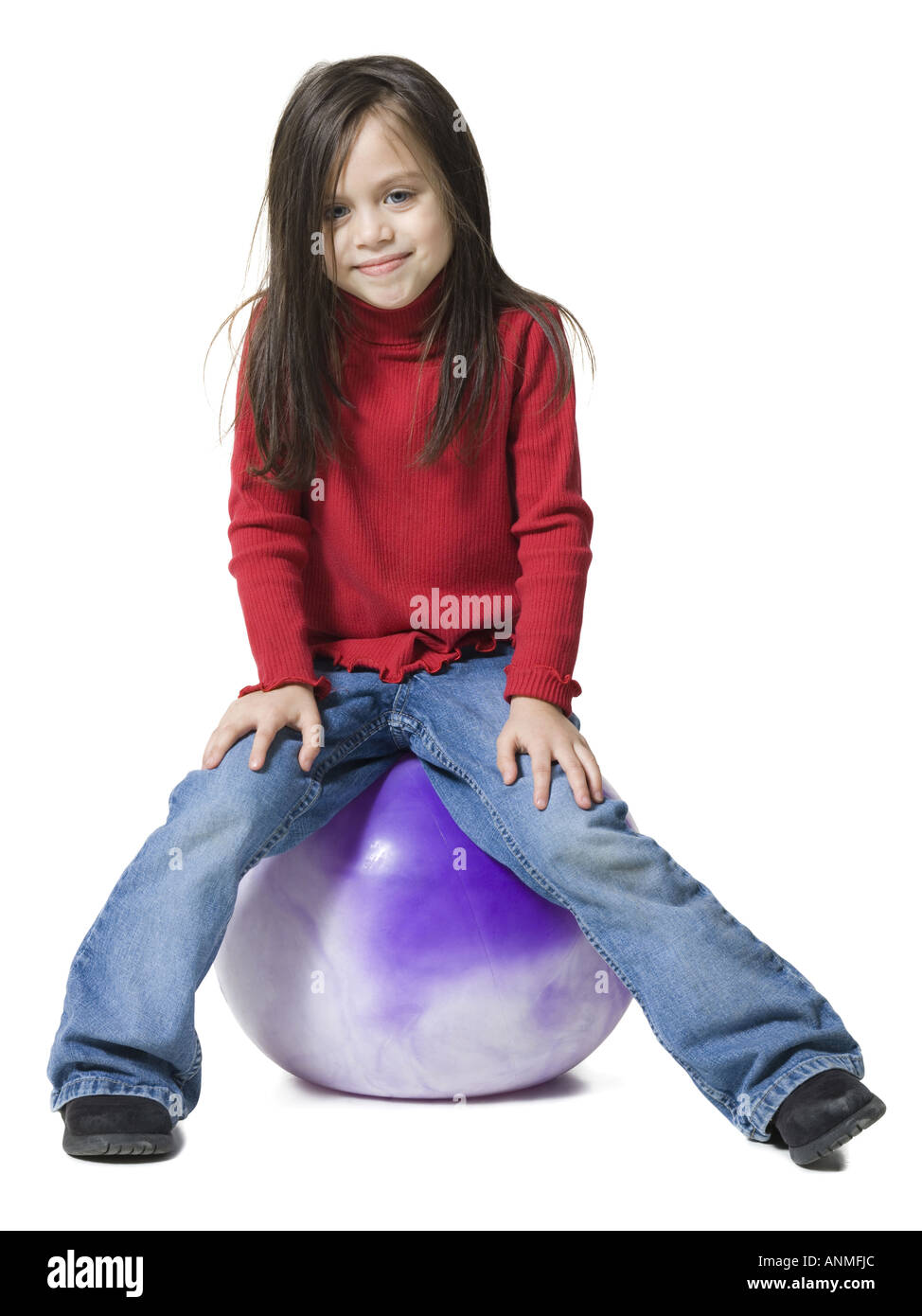 Portrait of a girl sitting on a ball Stock Photo - Alamy