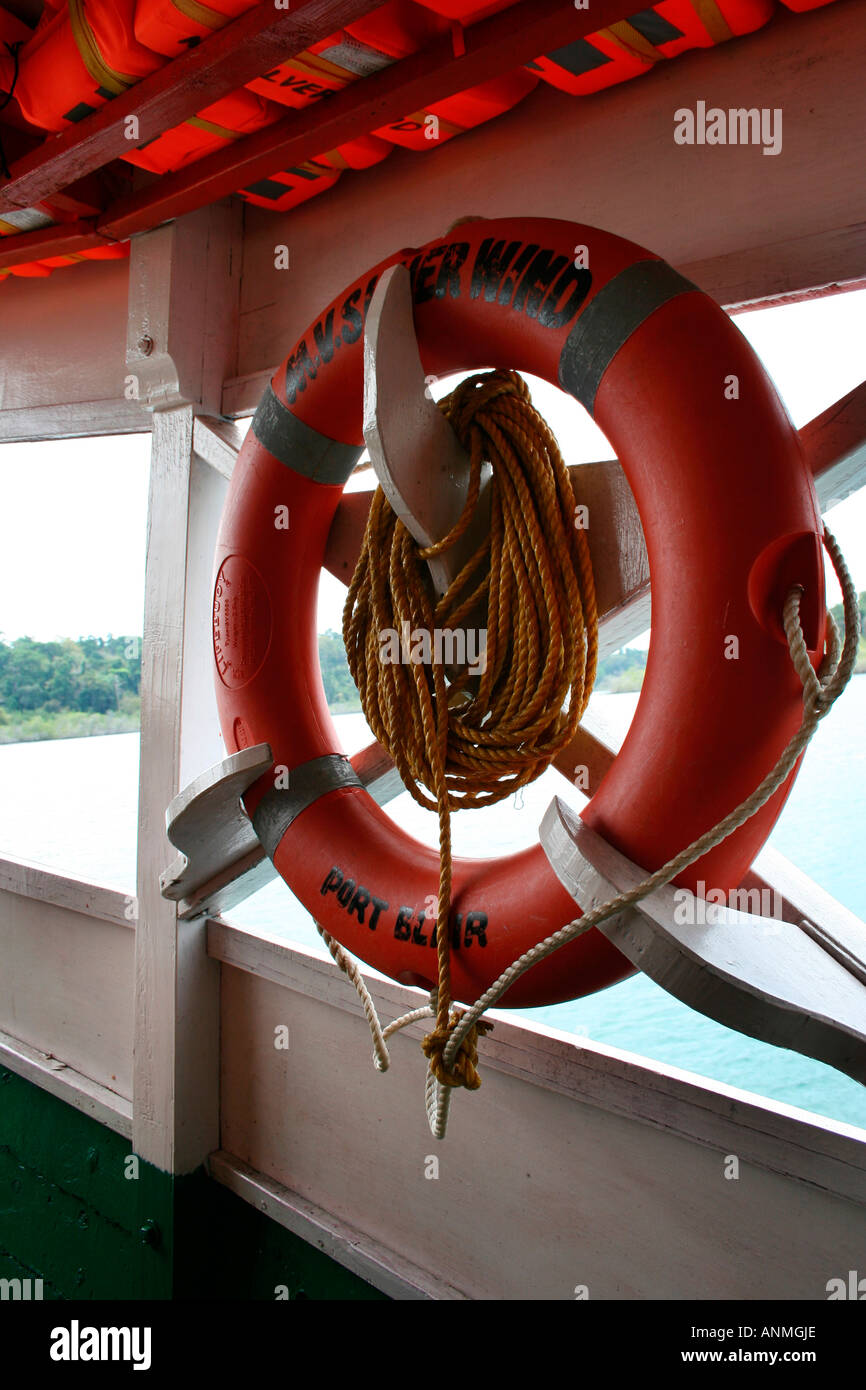 Life saving aids inside a ship with a view of sea and land through the ...