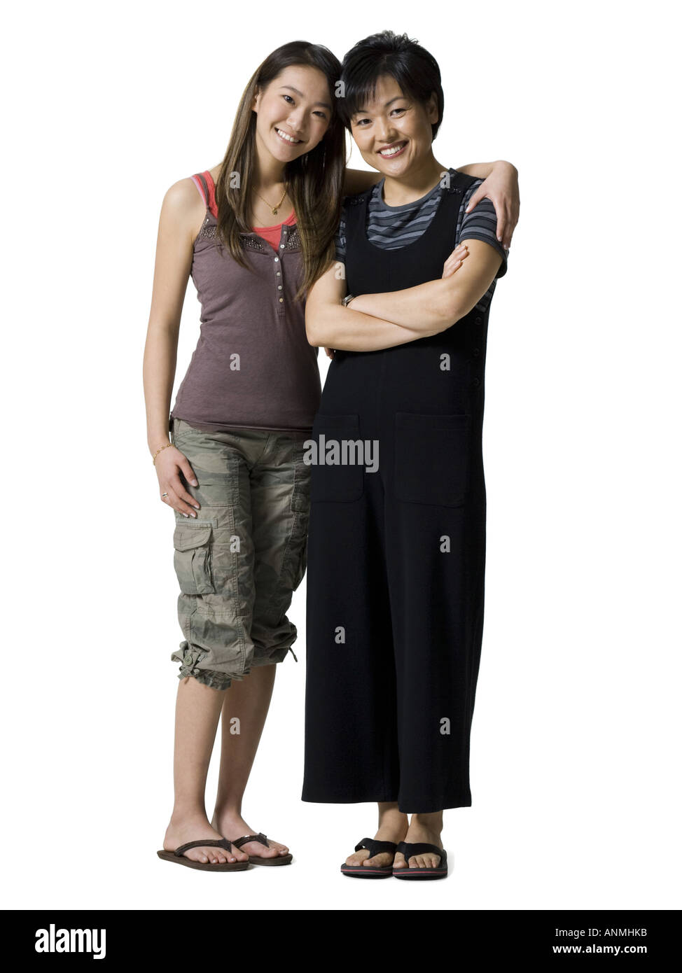 Portrait of a girl with her arm around her mother Stock Photo - Alamy