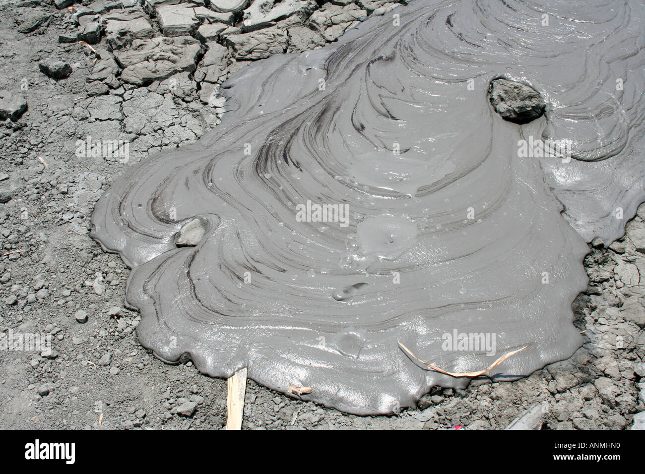 Close up of mud flowing out on the dried remains of a mud volcano at ...