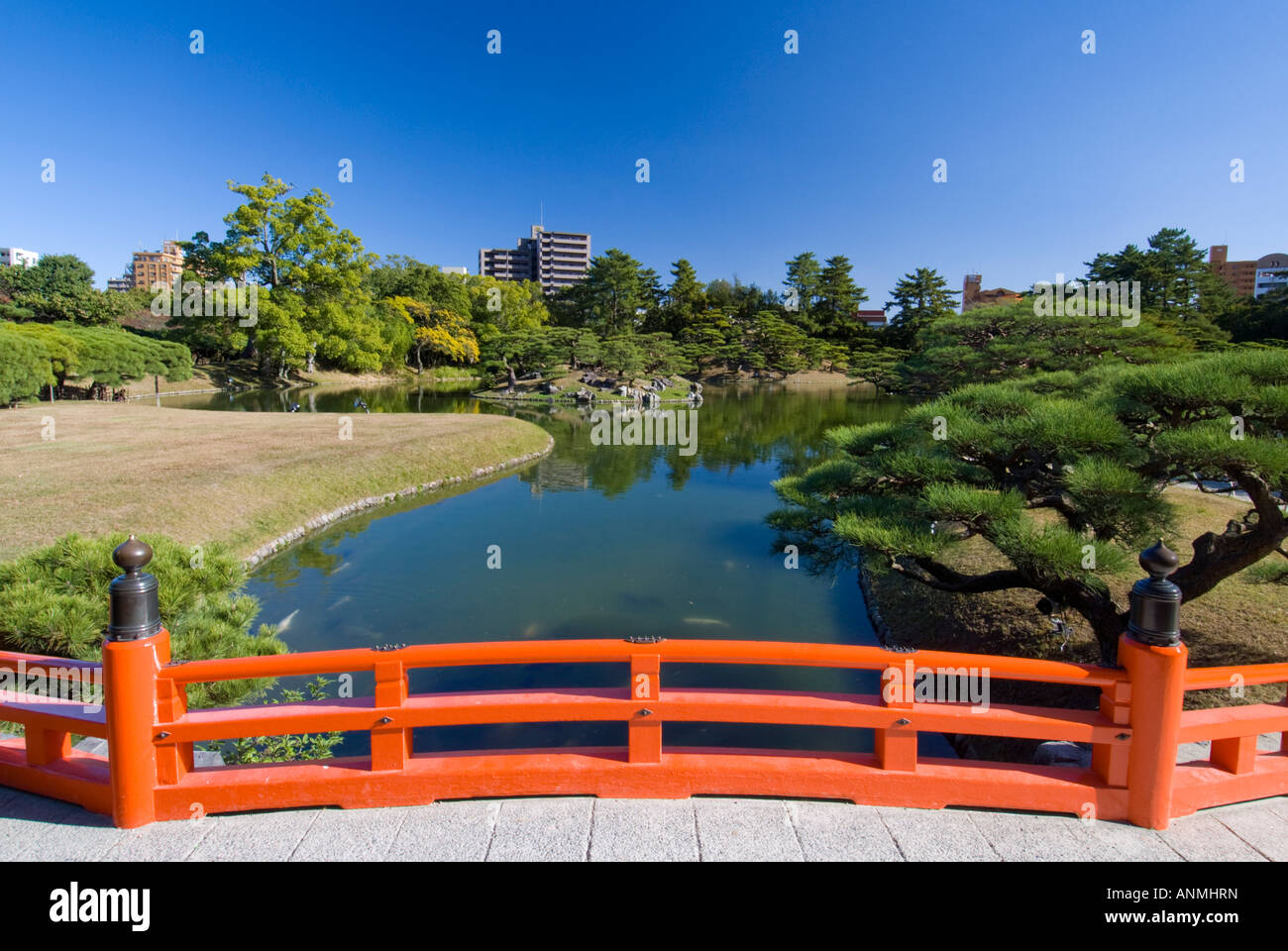 Traditional red bridge and lake in famous Ritsuin Garden in Takamatsu ...