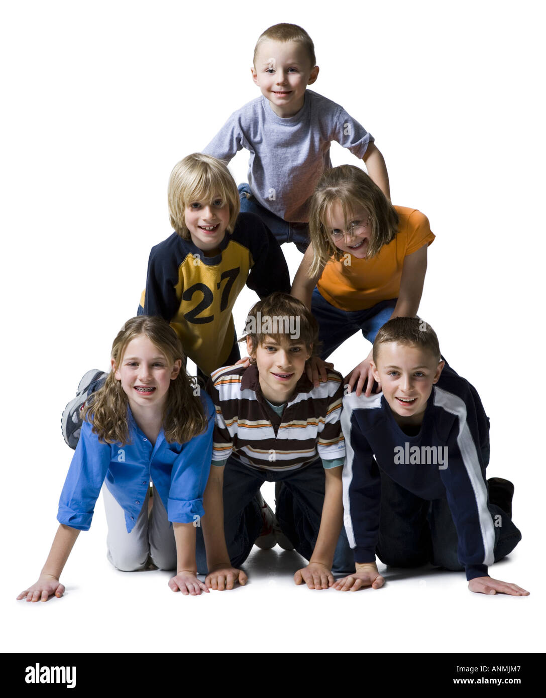Portrait of a group of children making a human pyramid Stock Photo - Alamy