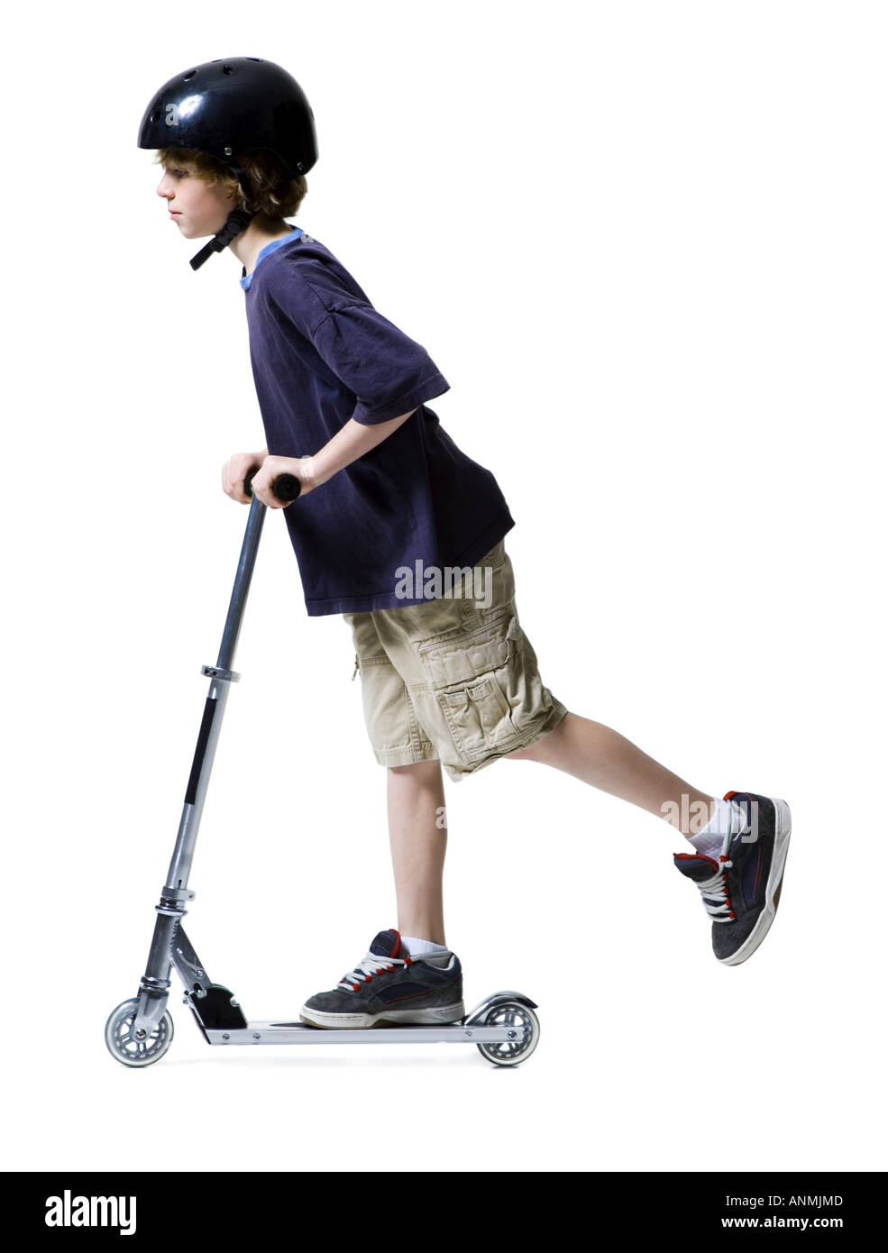 Profile of a boy riding on scooter Stock Photo - Alamy