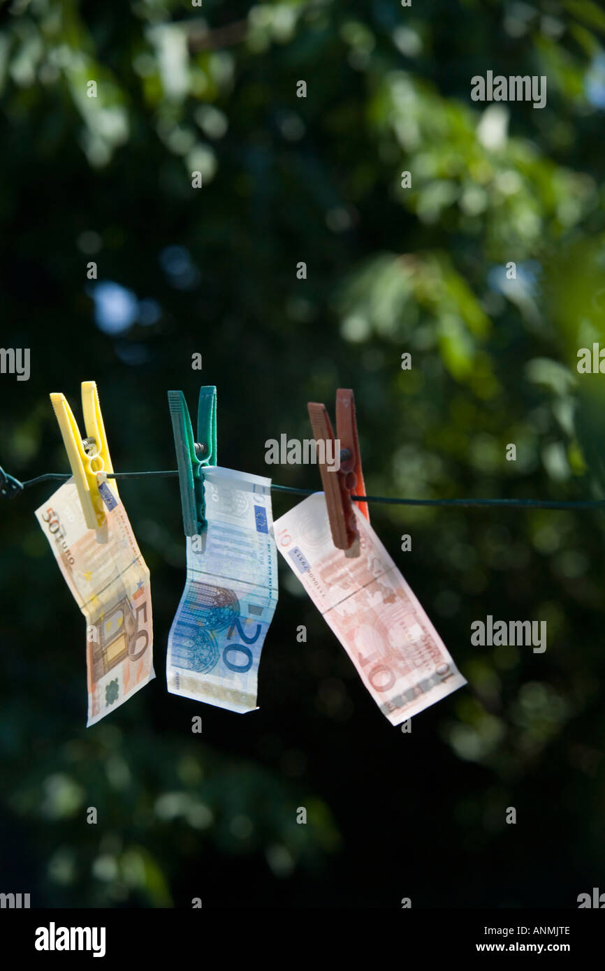 Money on a laundry line drying out Stock Photo - Alamy