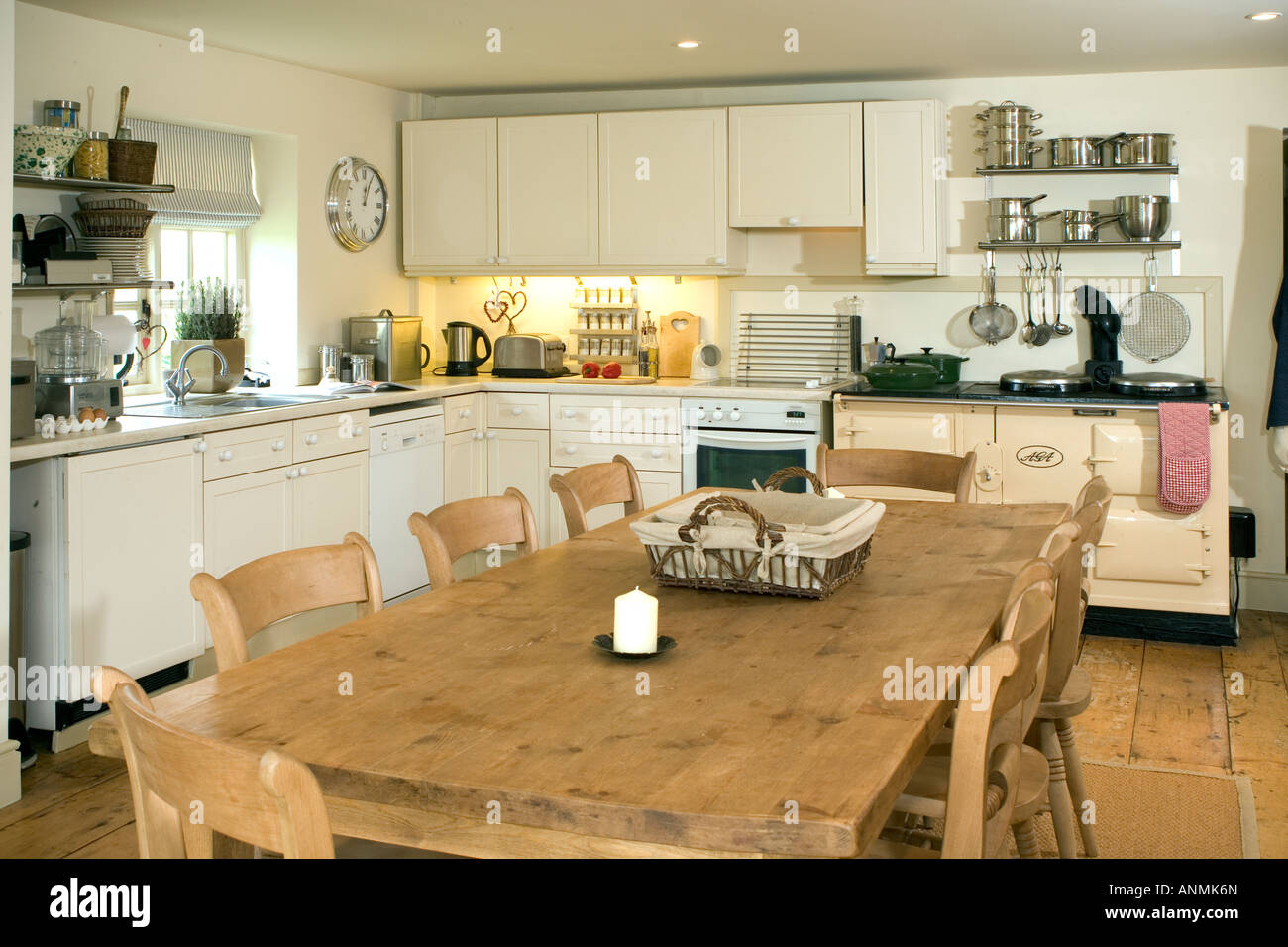 UK. A house interior, large traditional style kitchen with dining area ...