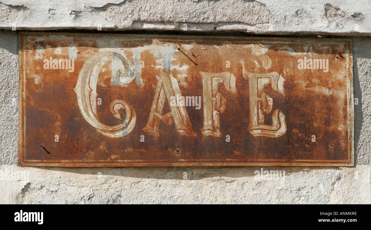 Old French cafe sign on rusting metal Stock Photo - Alamy