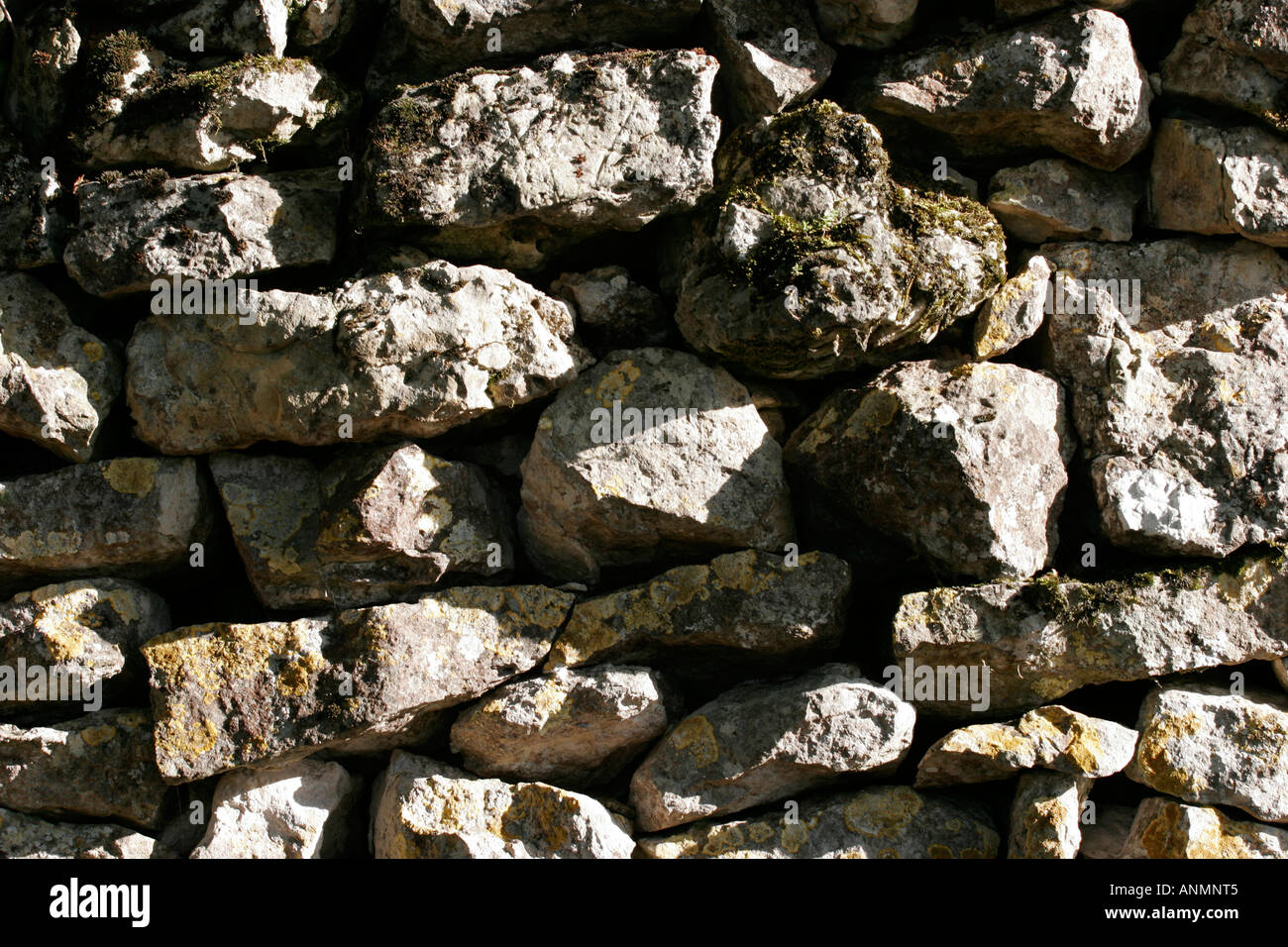 Dry stone rock wall close up Stock Photo - Alamy