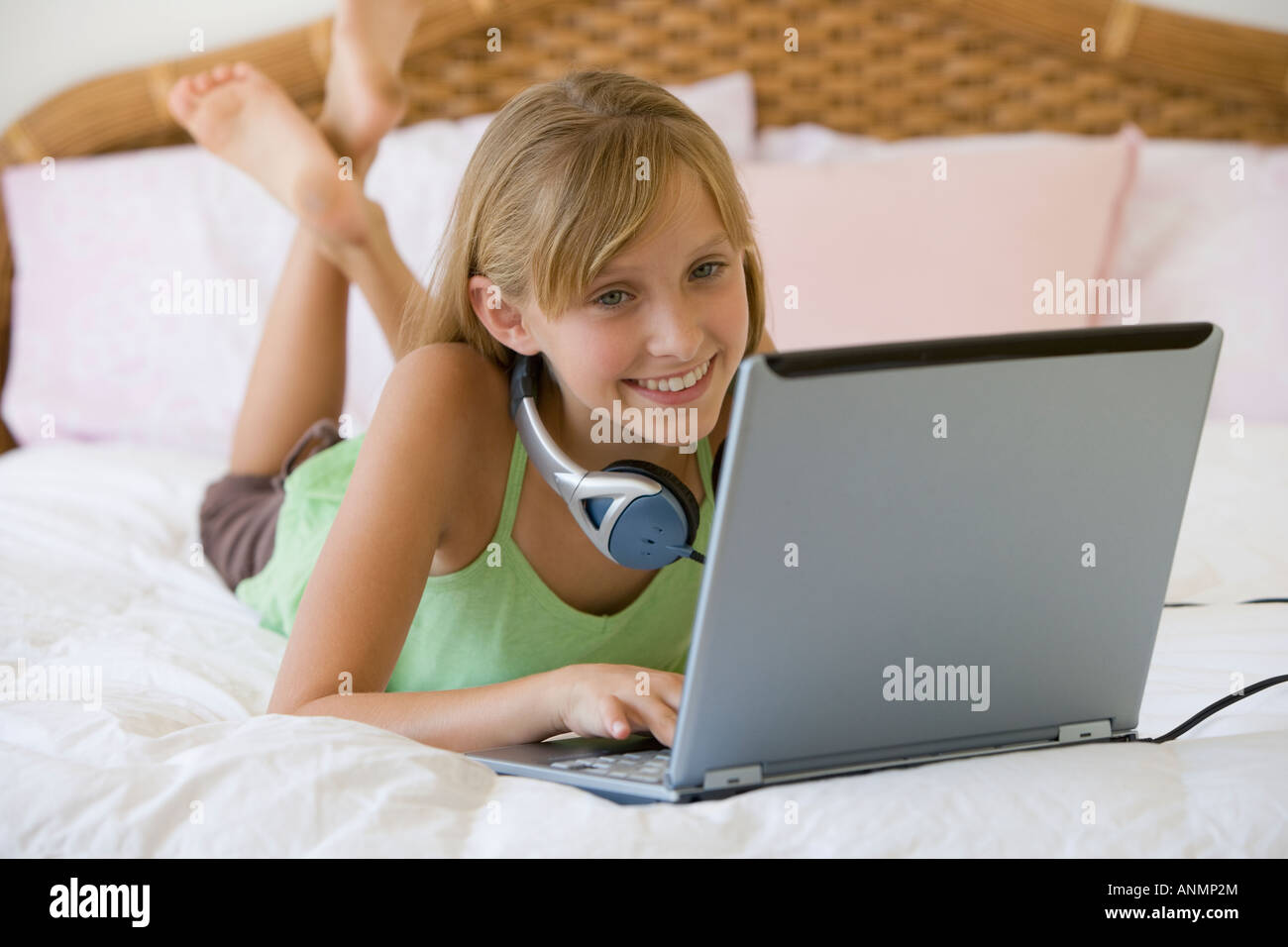 Teenaged girl typing on laptop Stock Photo - Alamy