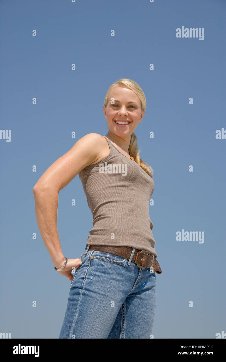 Young woman with hand in back pocket Stock Photo - Alamy