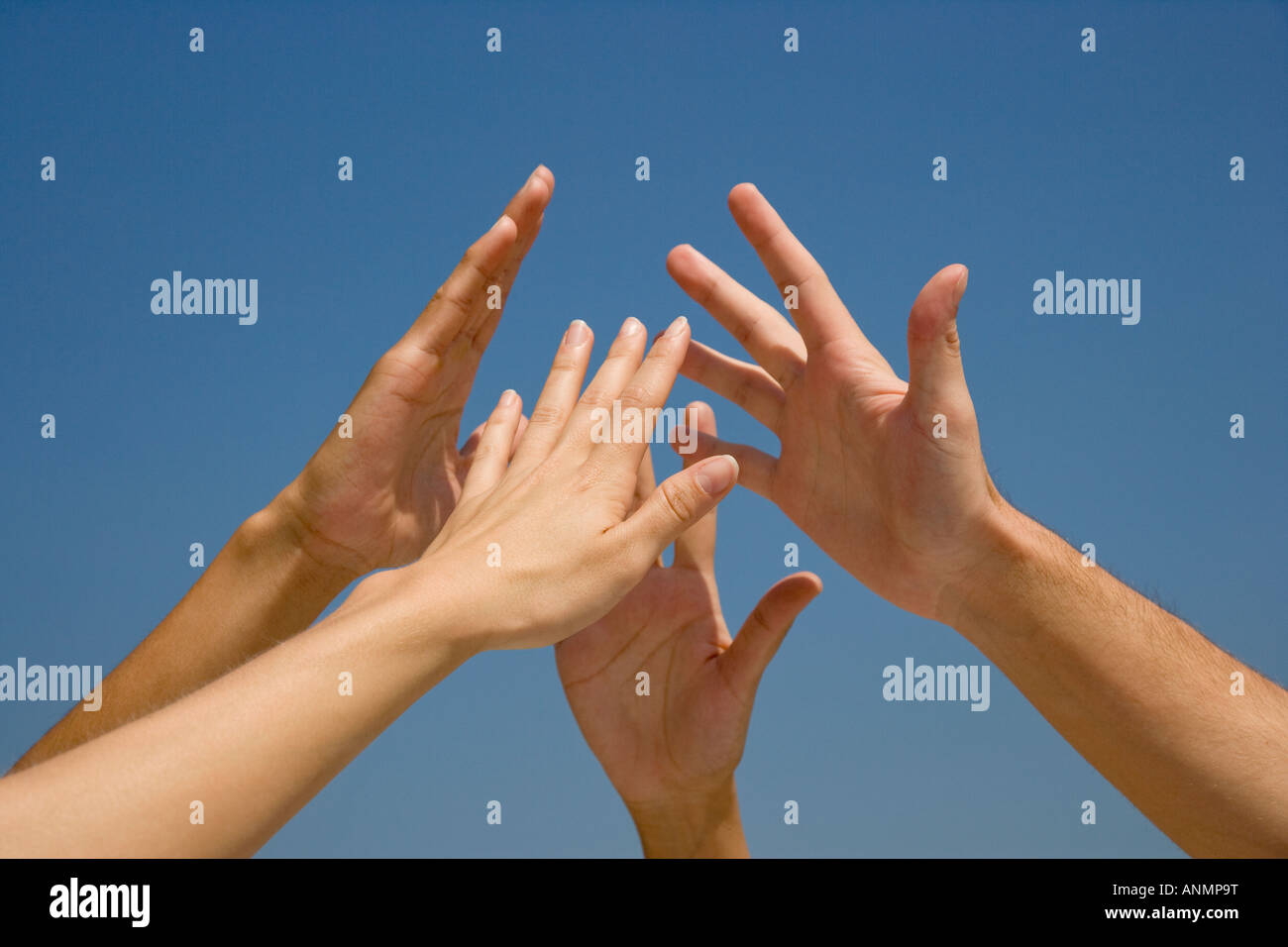 Four hands in circle hi-res stock photography and images - Alamy