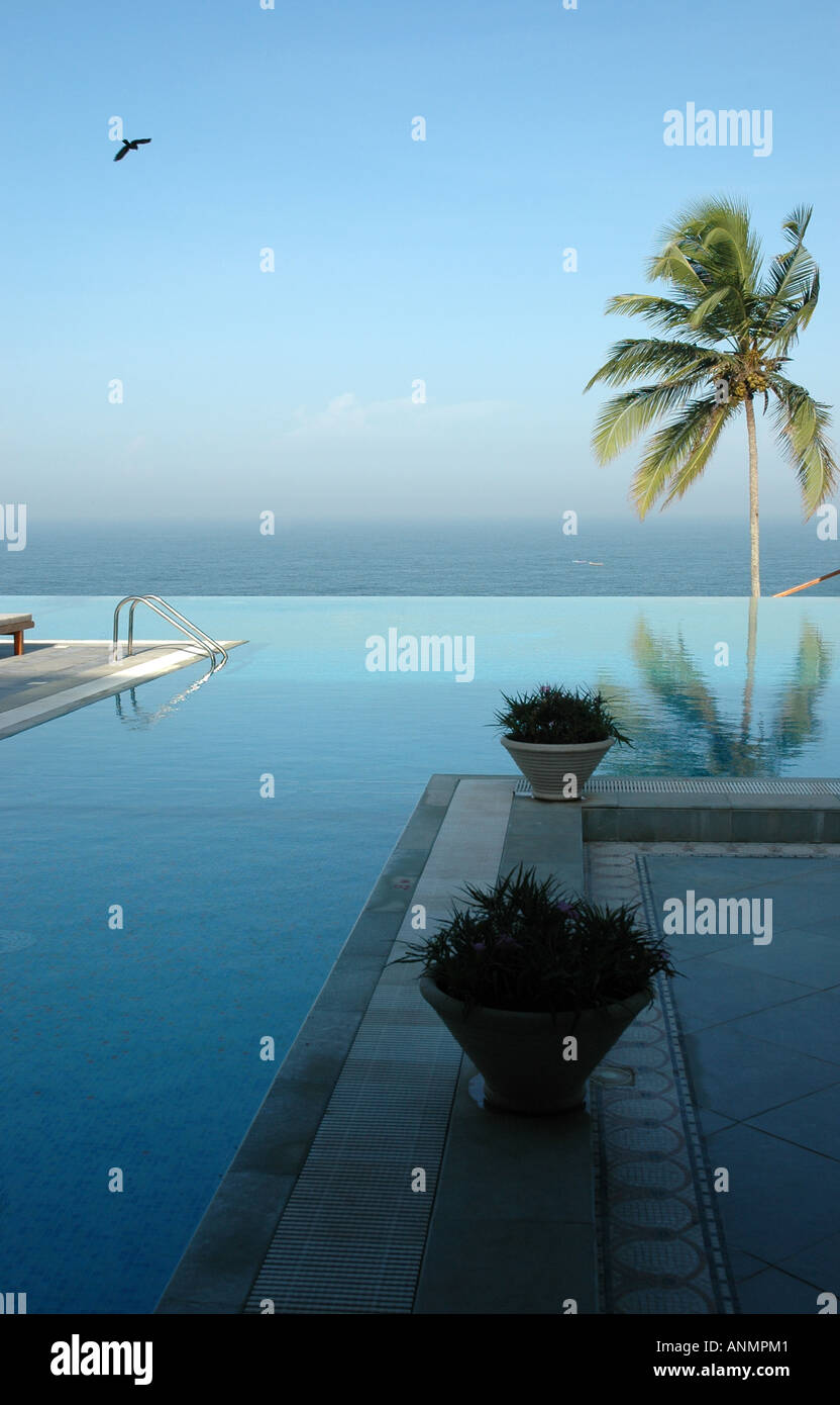 View over infinity swimming pool and sea at the Leela Hotel Kerala ...