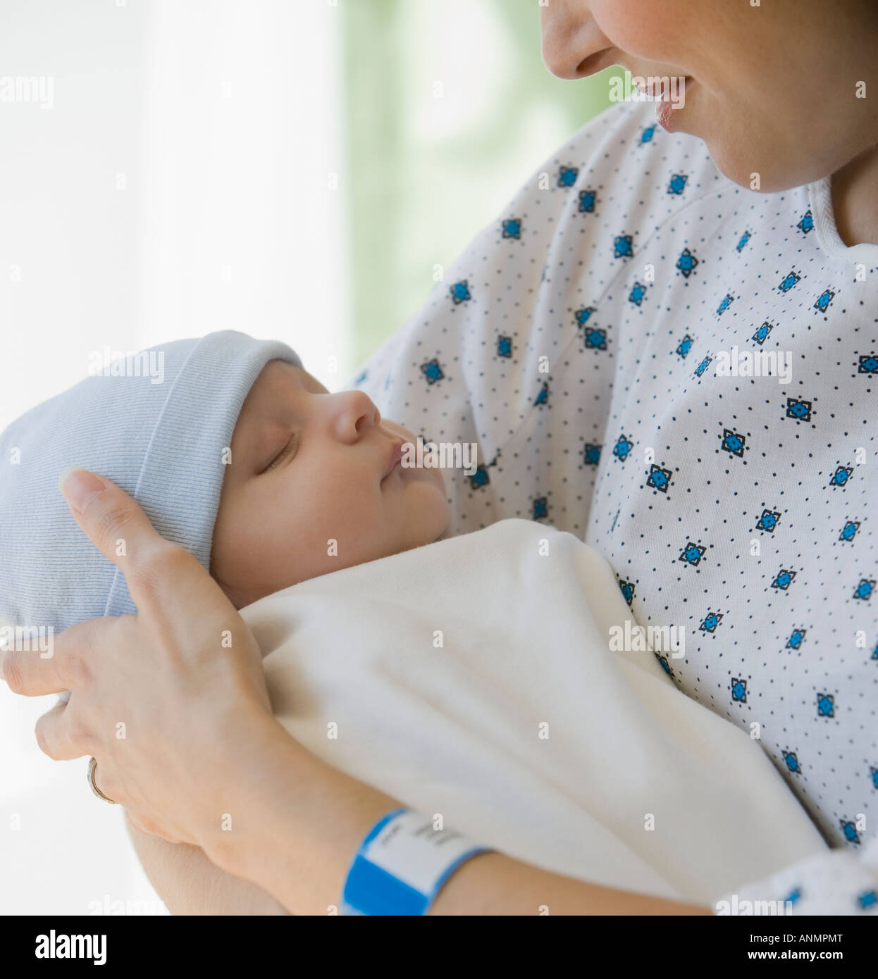 Mother holding newborn in hospital Stock Photo - Alamy