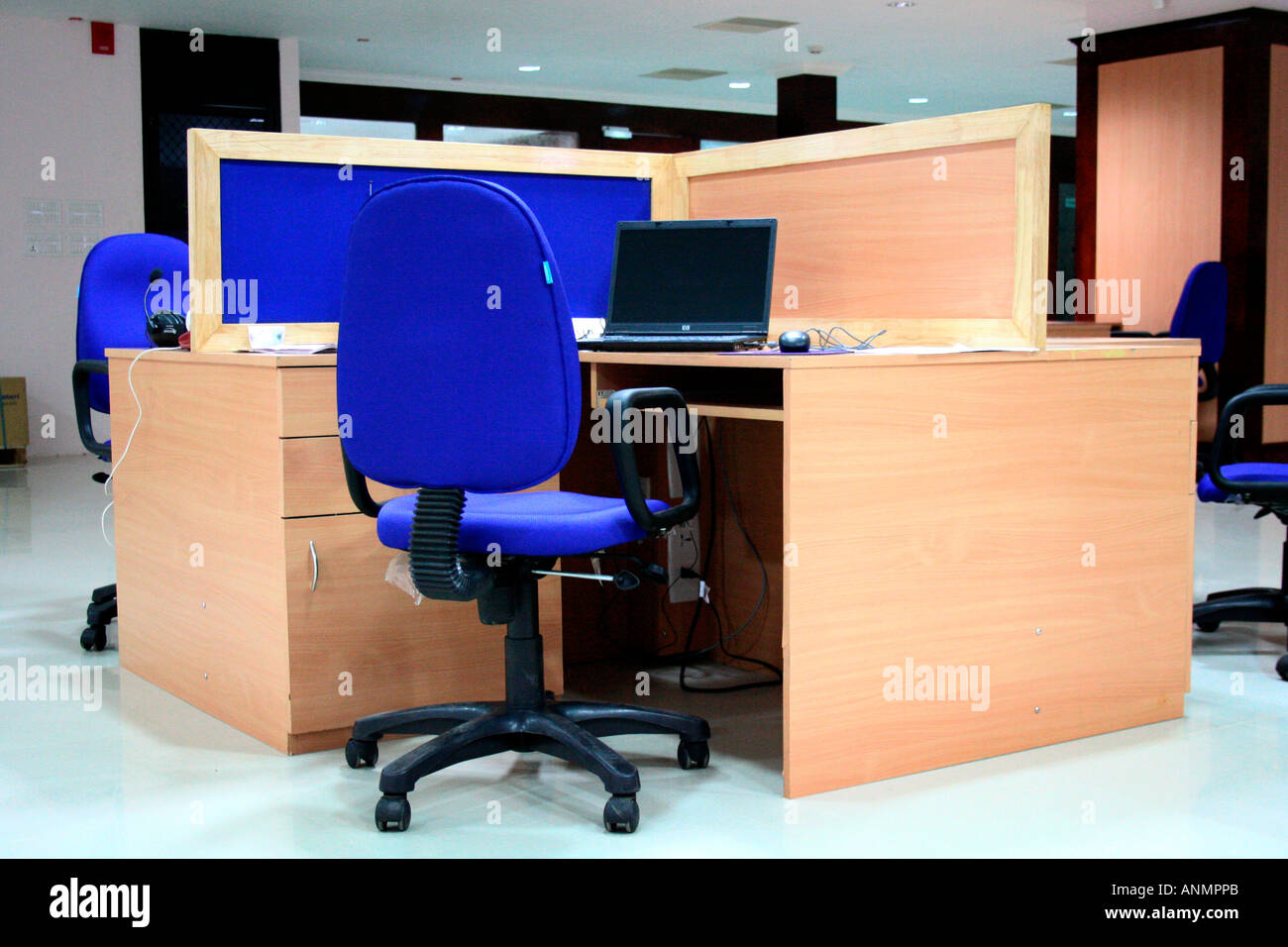 A close up view of a cubicle with a laptop computer on the table inside an office space Stock ...