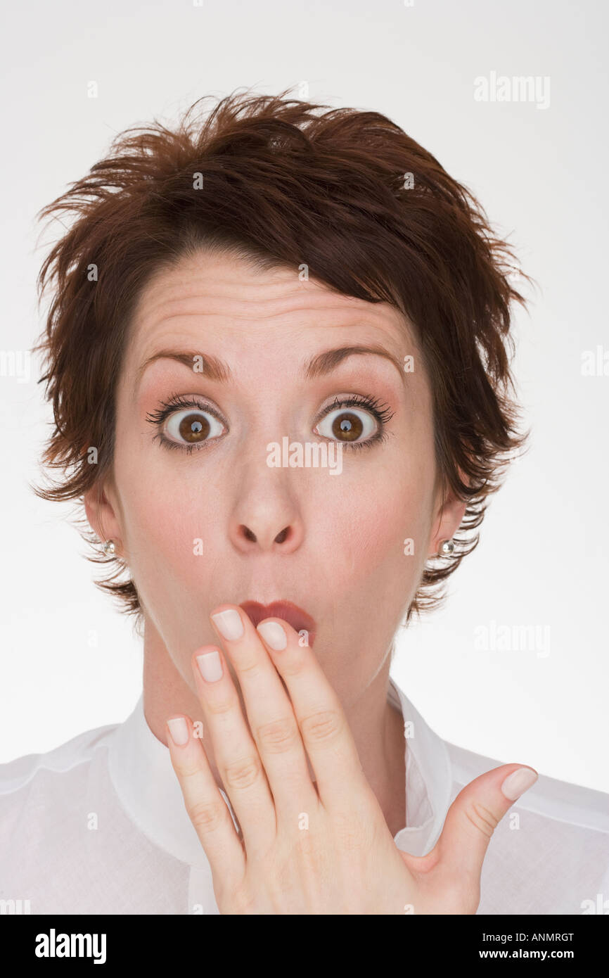 Surprised mid adult woman studio hi-res stock photography and images ...