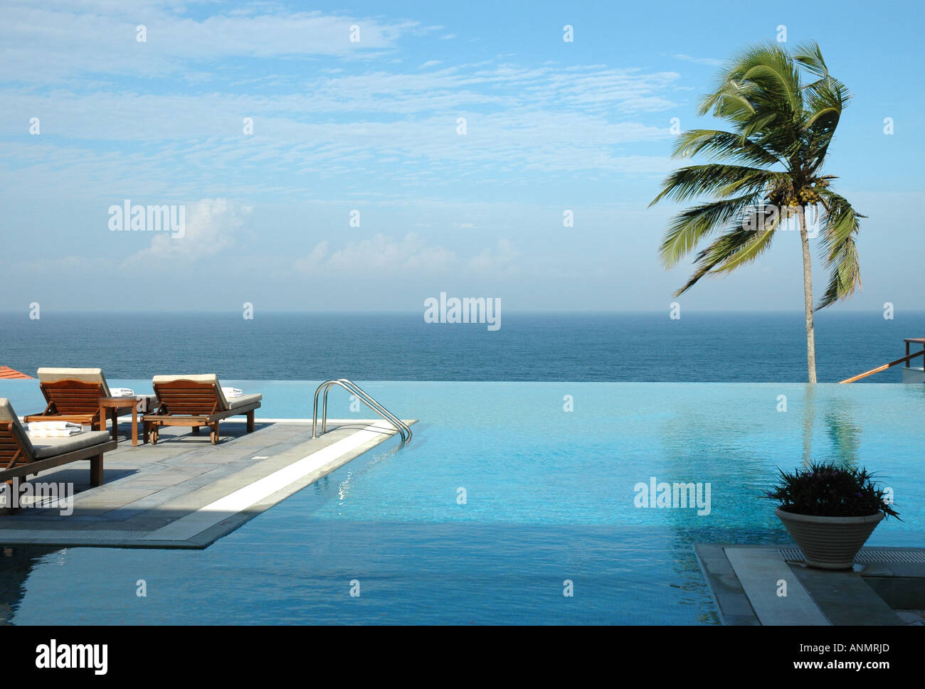 View over infinity swimming pool and sea at the Leela Hotel Kerala ...