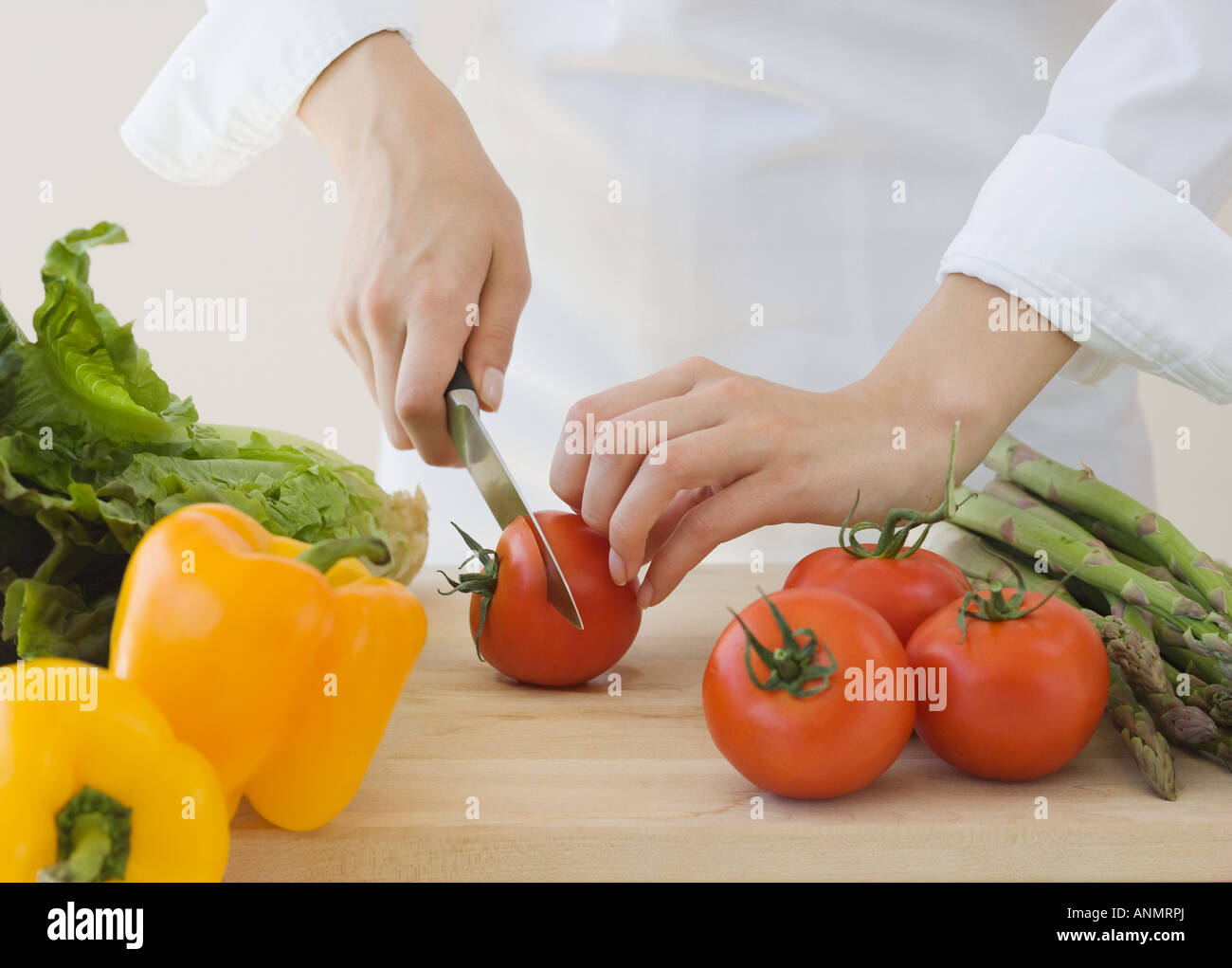 Woman chopping vegetables Stock Photo - Alamy