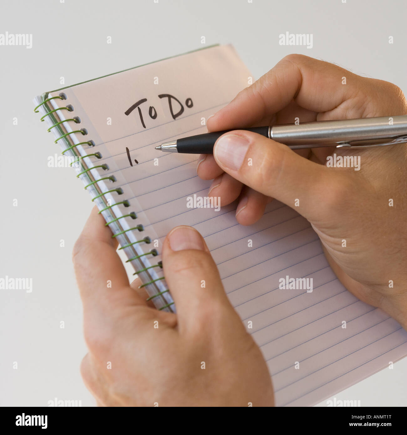 Man writing to do list Stock Photo - Alamy