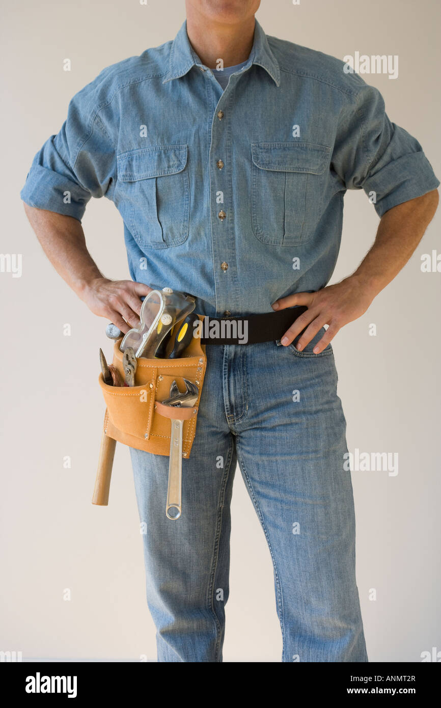Man wearing tool belt Stock Photo - Alamy