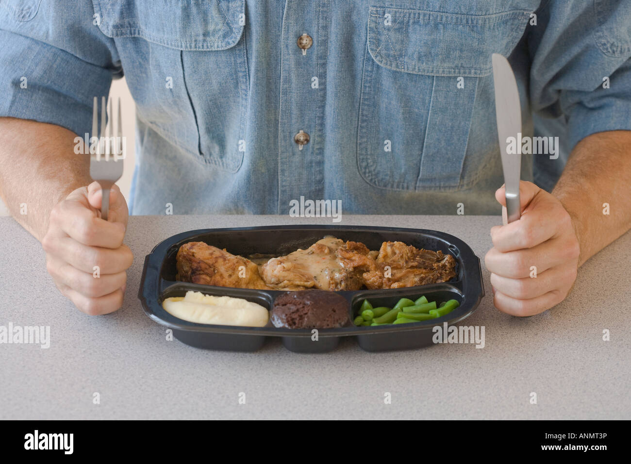 Man eating tv dinner hi-res stock photography and images - Alamy