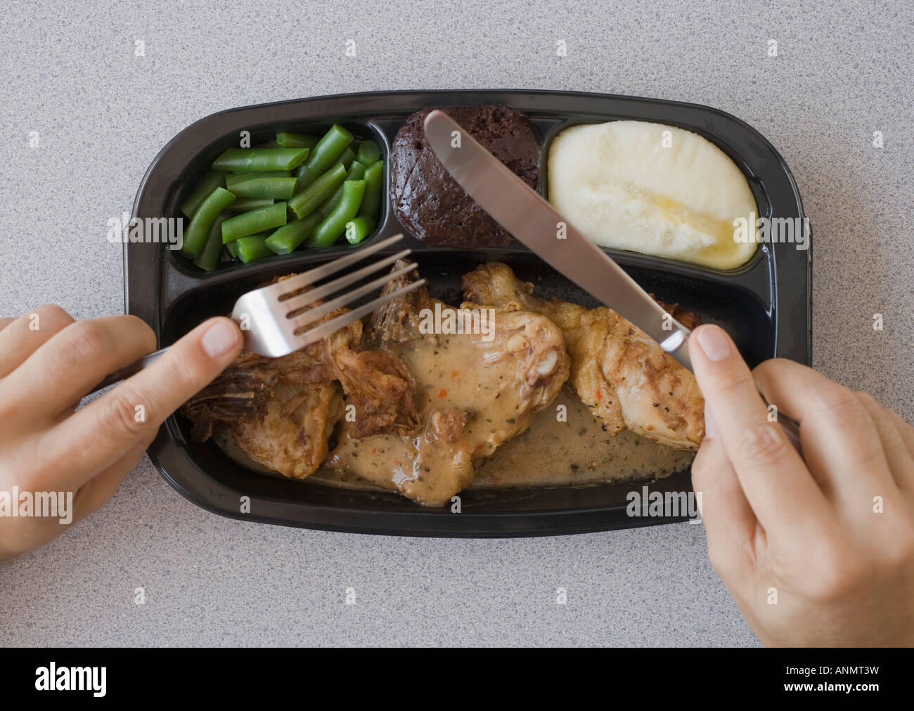 Man eating TV dinner Stock Photo - Alamy