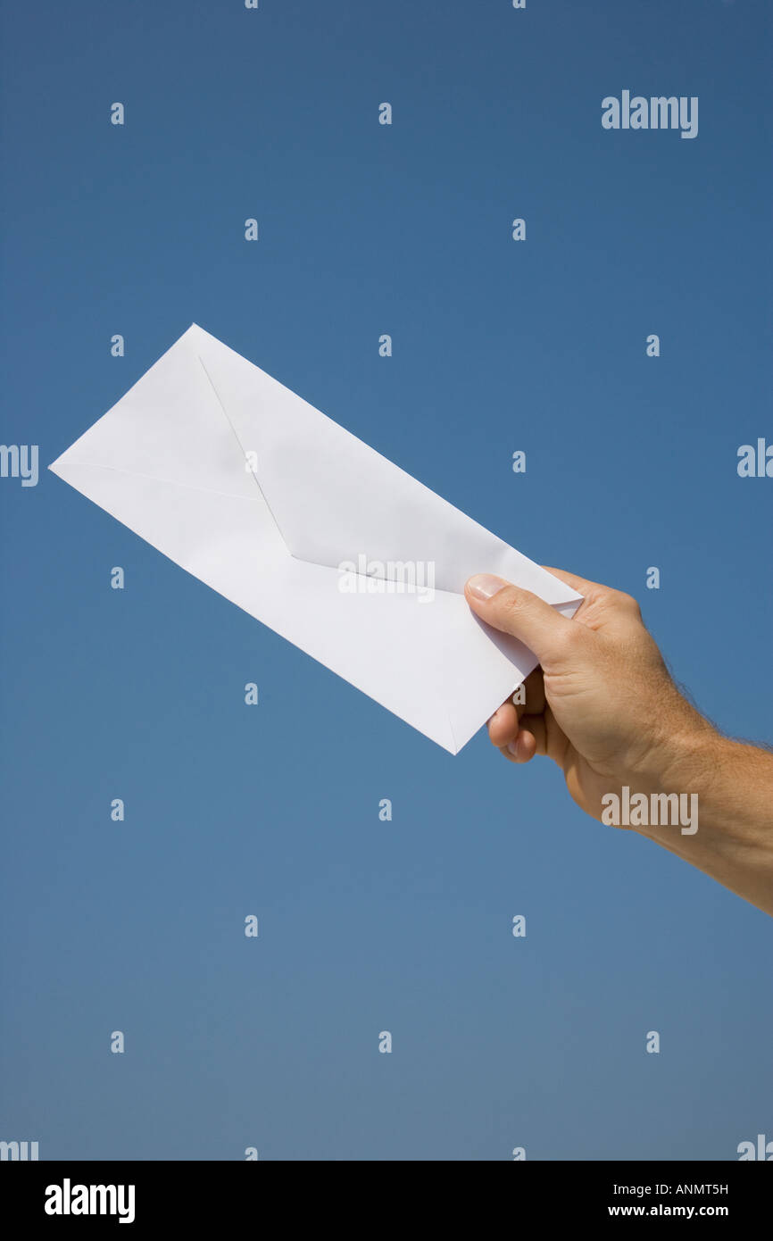 Man holding envelope Stock Photo - Alamy