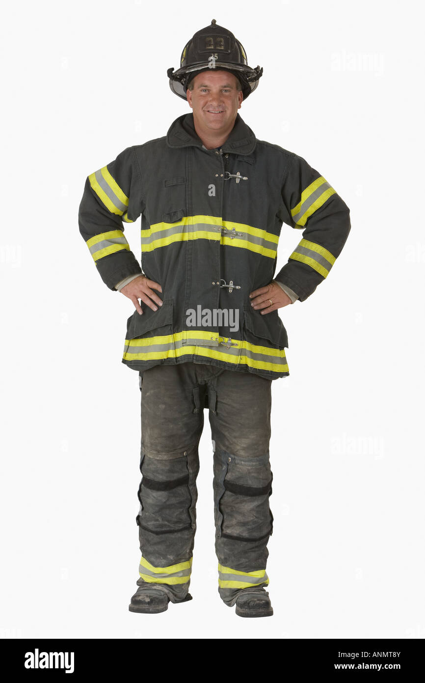 Male firefighter with hands on hips Stock Photo - Alamy