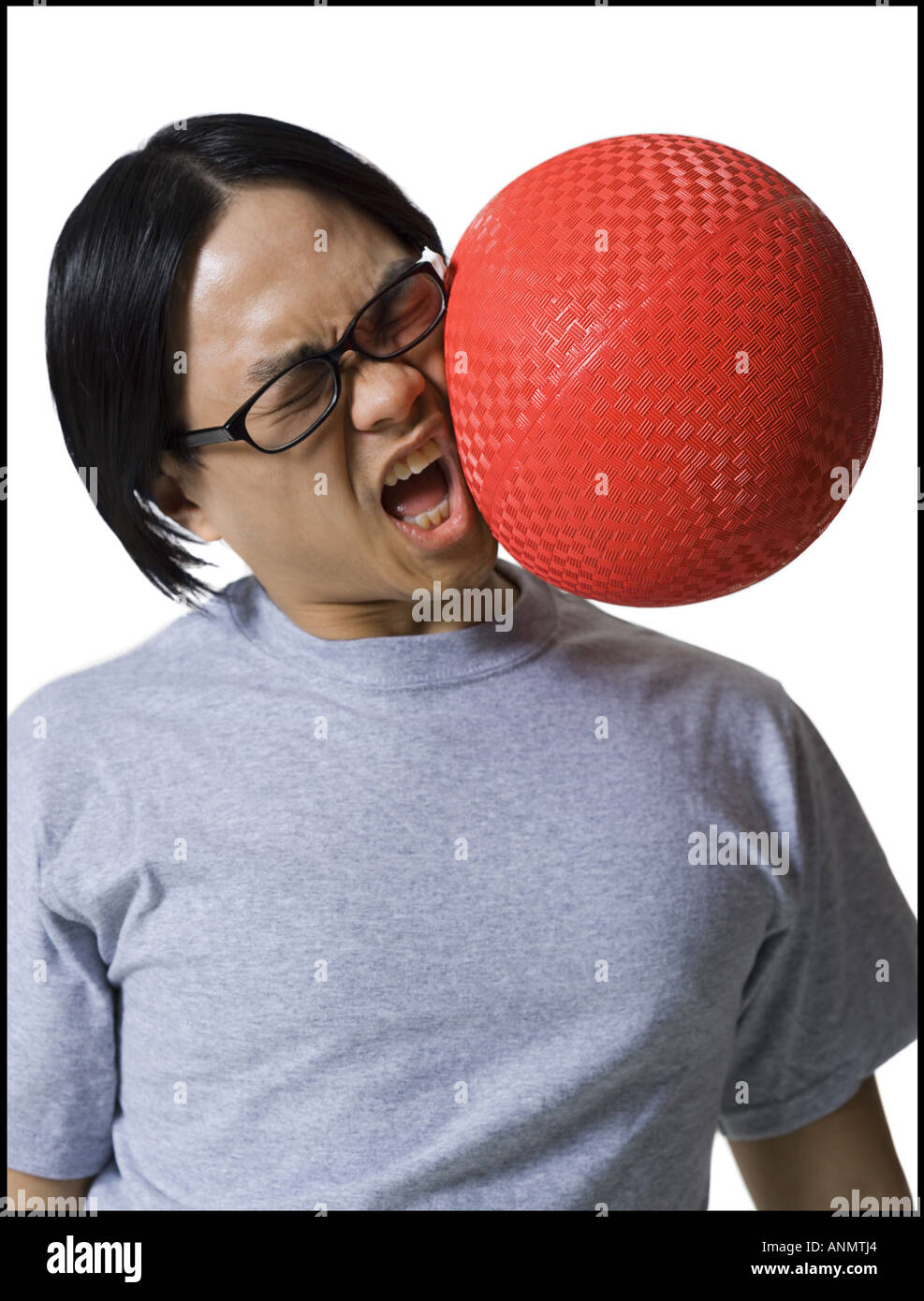 Ball striking a young man s face Stock Photo - Alamy