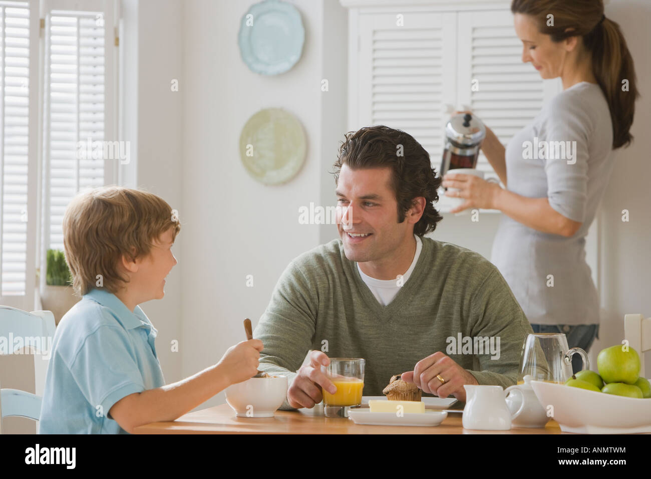 Father and son at breakfast table Stock Photo - Alamy