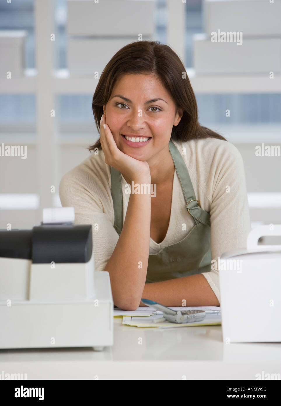 Hispanic bakery worker behind counter Stock Photo - Alamy
