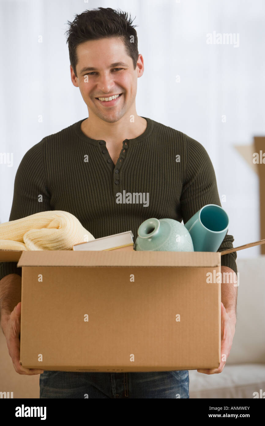 Man carrying moving box Stock Photo - Alamy