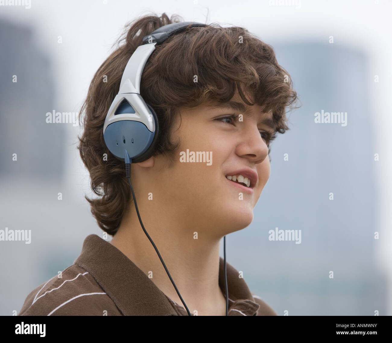 Teenaged boy wearing headphones Stock Photo - Alamy