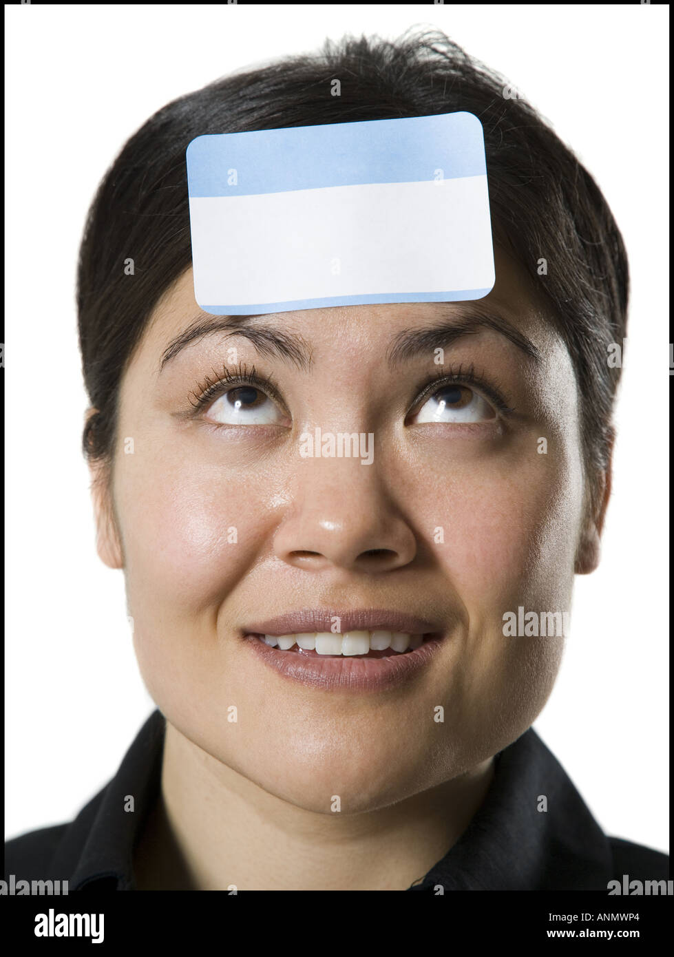 Close up of a young woman with a blank name tag on her forehead Stock ...