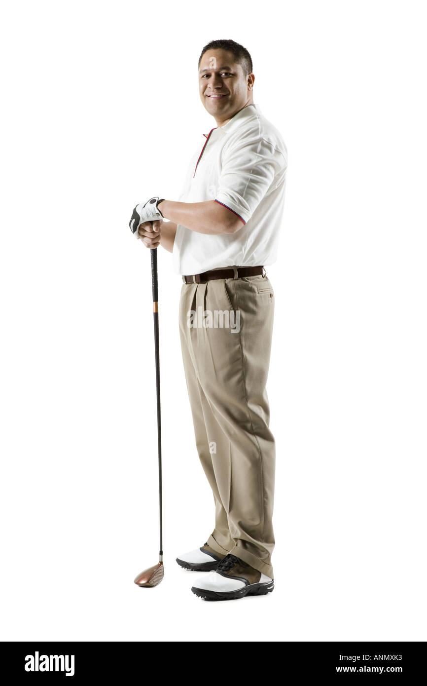 Profile of a mid adult man holding a golf club Stock Photo - Alamy