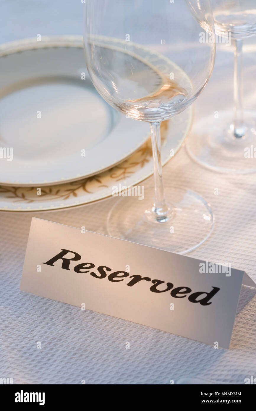 Reserved sign at place setting Stock Photo - Alamy