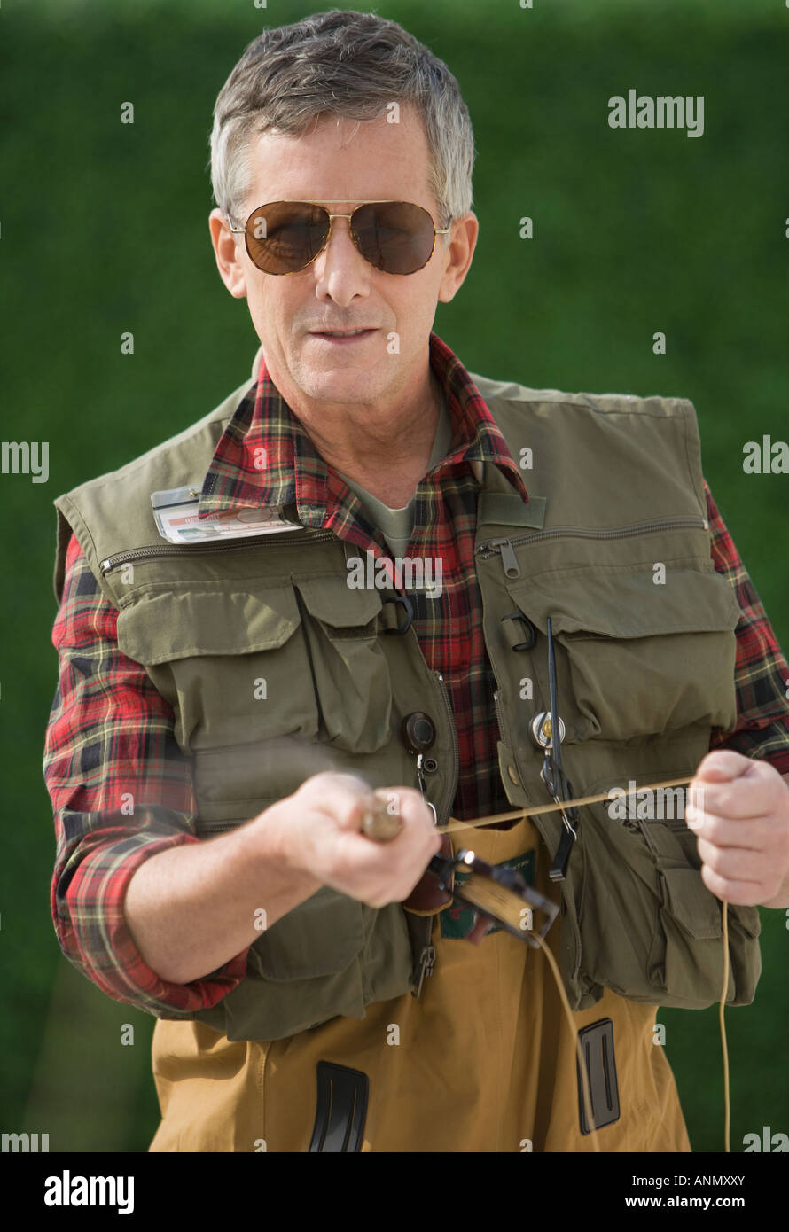 Man fly fishing Stock Photo - Alamy
