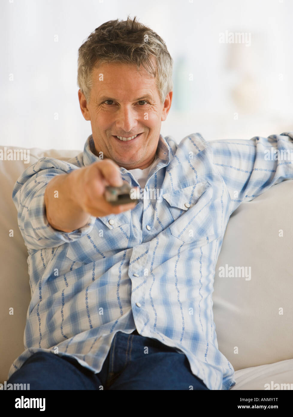 Man with tv remote control hi-res stock photography and images - Alamy