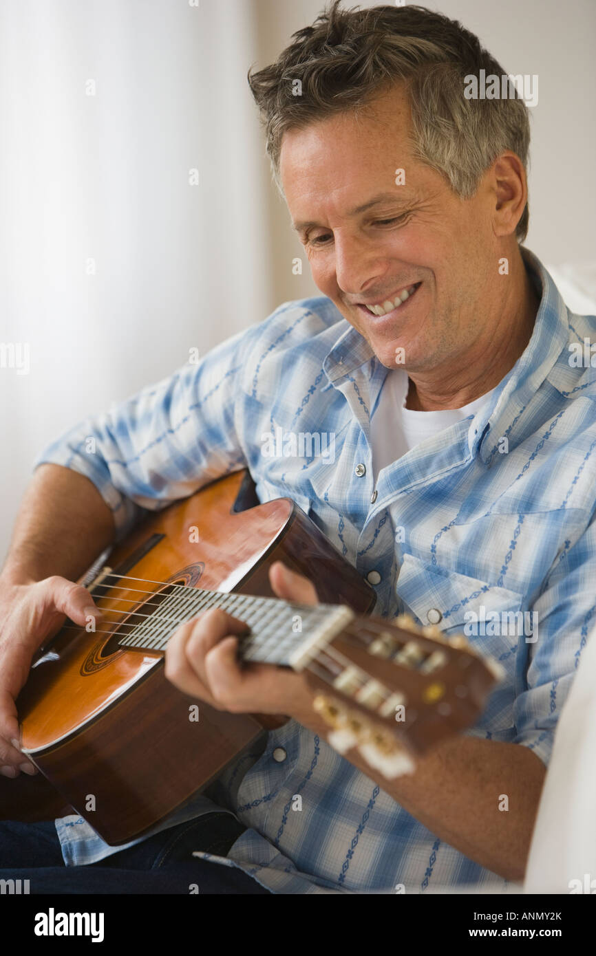 Man playing acoustic guitar Stock Photo - Alamy