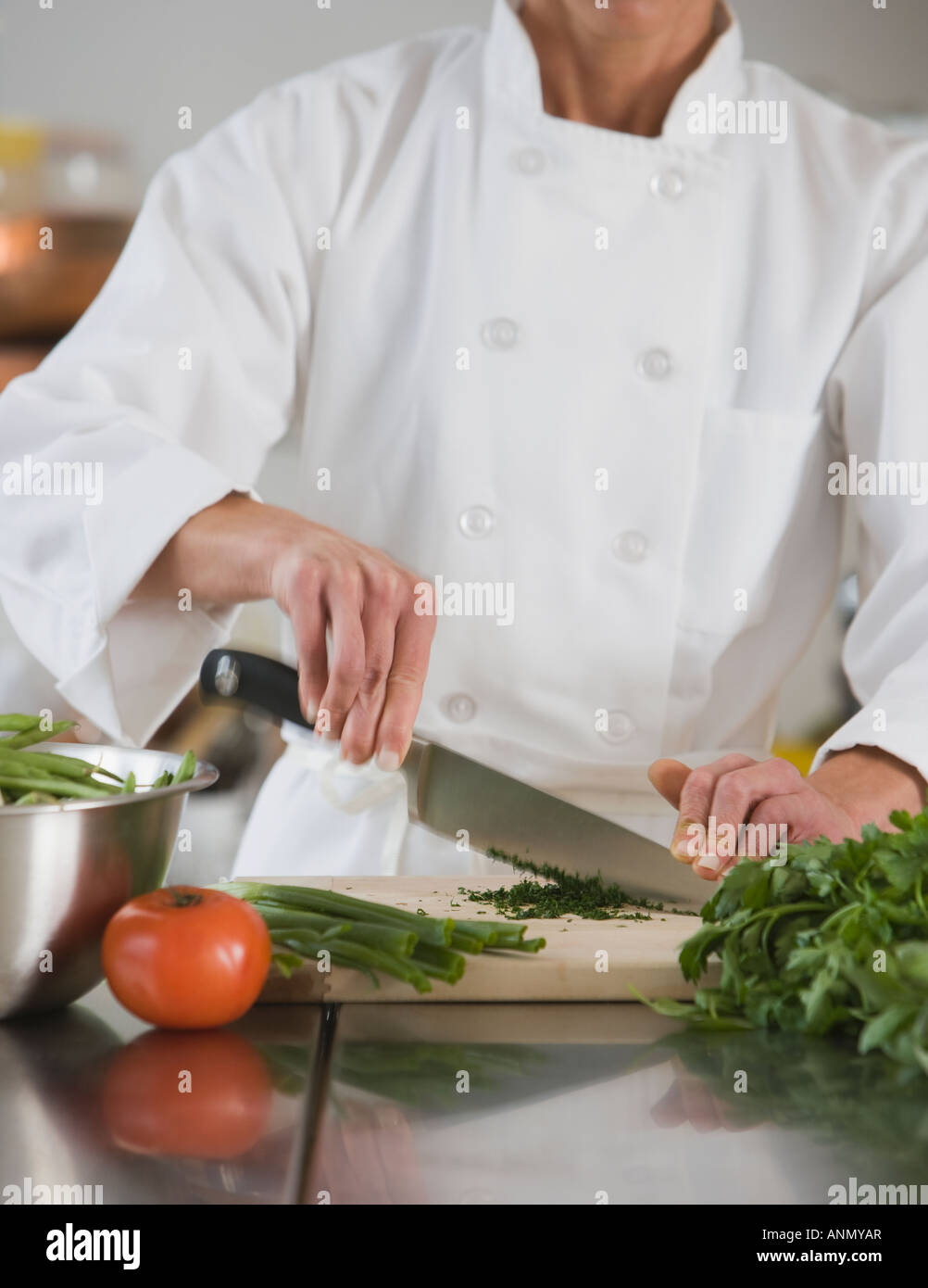 Female chef chopping vegetables Stock Photo - Alamy