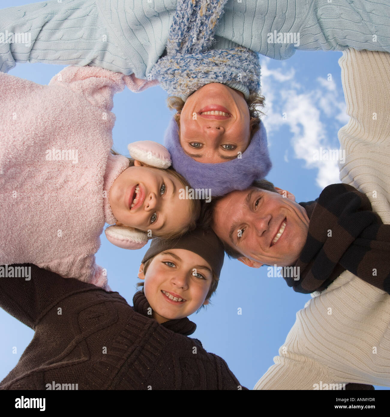 People huddle together in below hi-res stock photography and images - Alamy