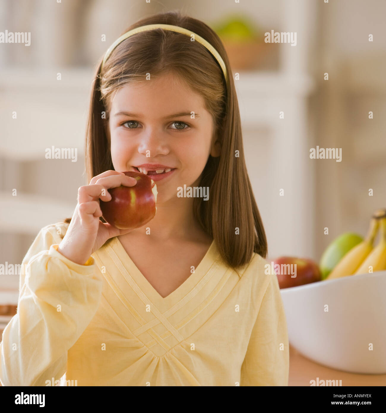 Girl eating apple Stock Photo - Alamy