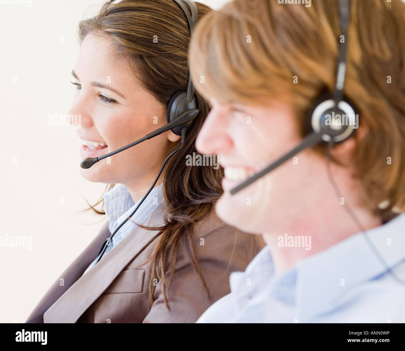 Two business people wearing headsets hi-res stock photography and ...