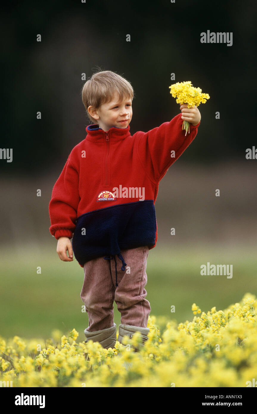 boy with bunch of flowers Stock Photo - Alamy