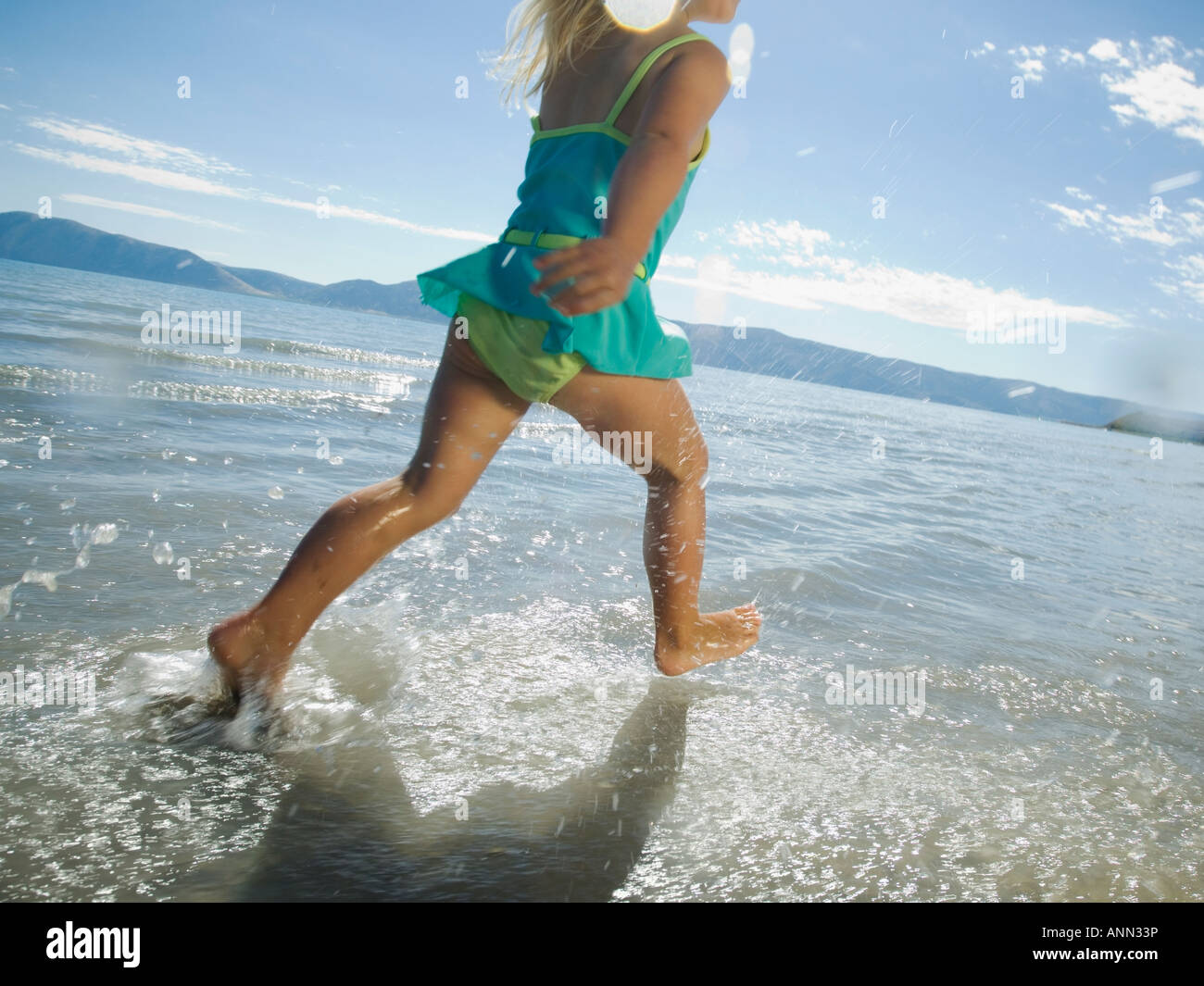 Girl walking in shallow water hi-res stock photography and images - Alamy