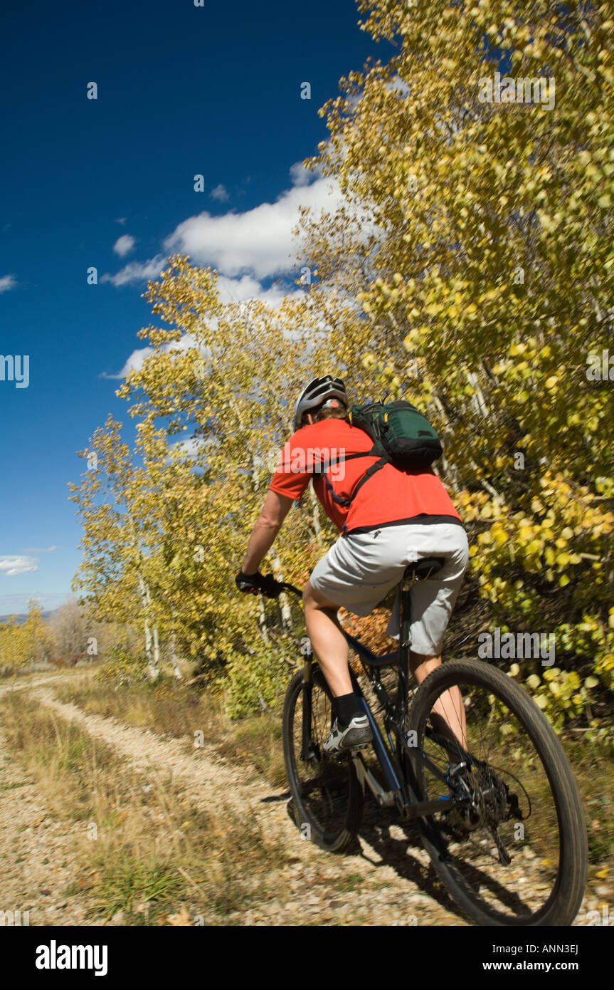 Person riding bike uphill hi-res stock photography and images - Alamy