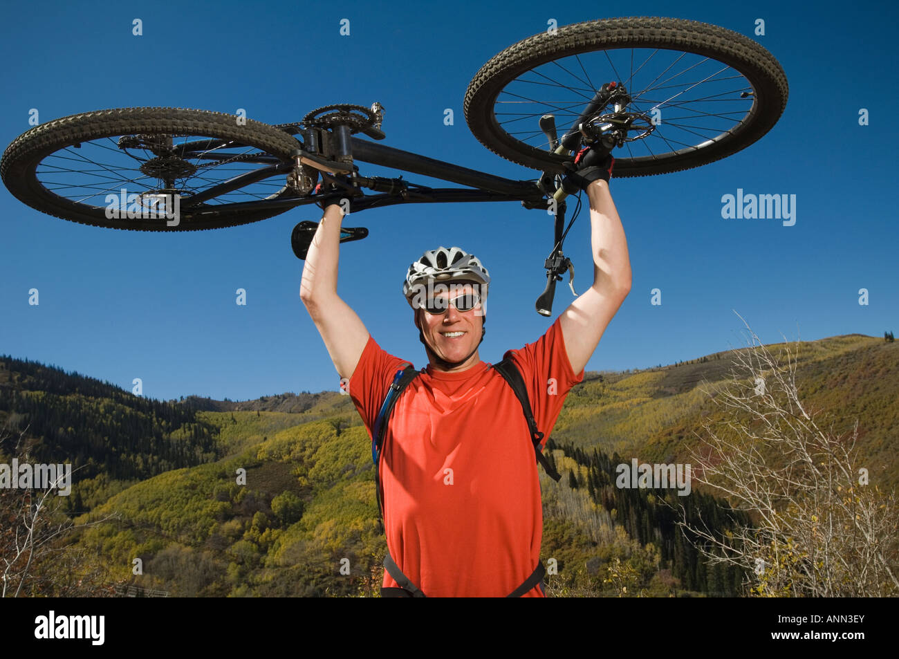 Man holding bike over head hi-res stock photography and images - Alamy