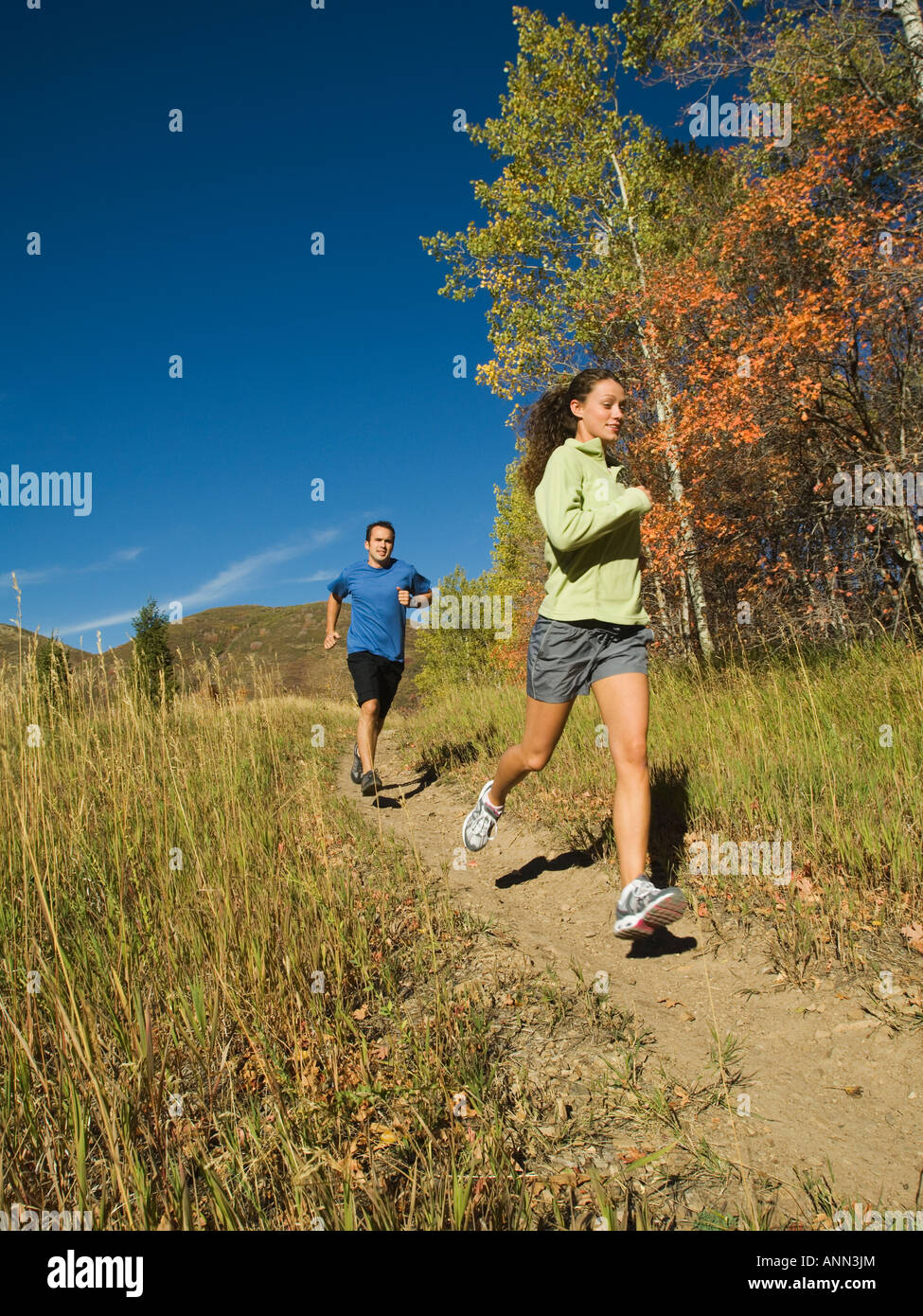 Couple jogging on trail, Utah, United States Stock Photo - Alamy