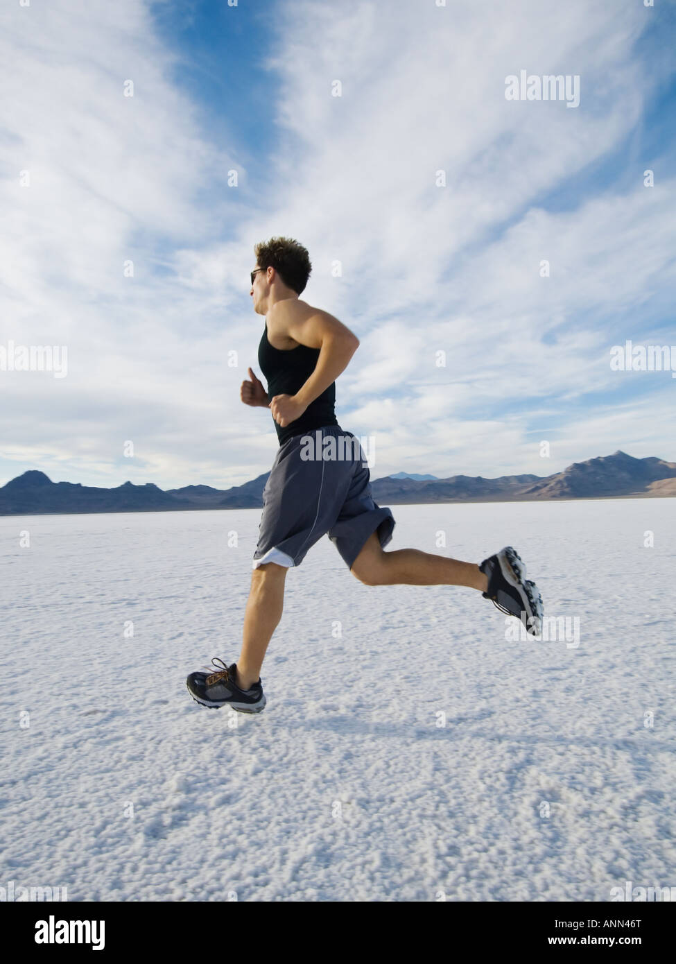 Man running on salt flats, Utah, United States Stock Photo - Alamy