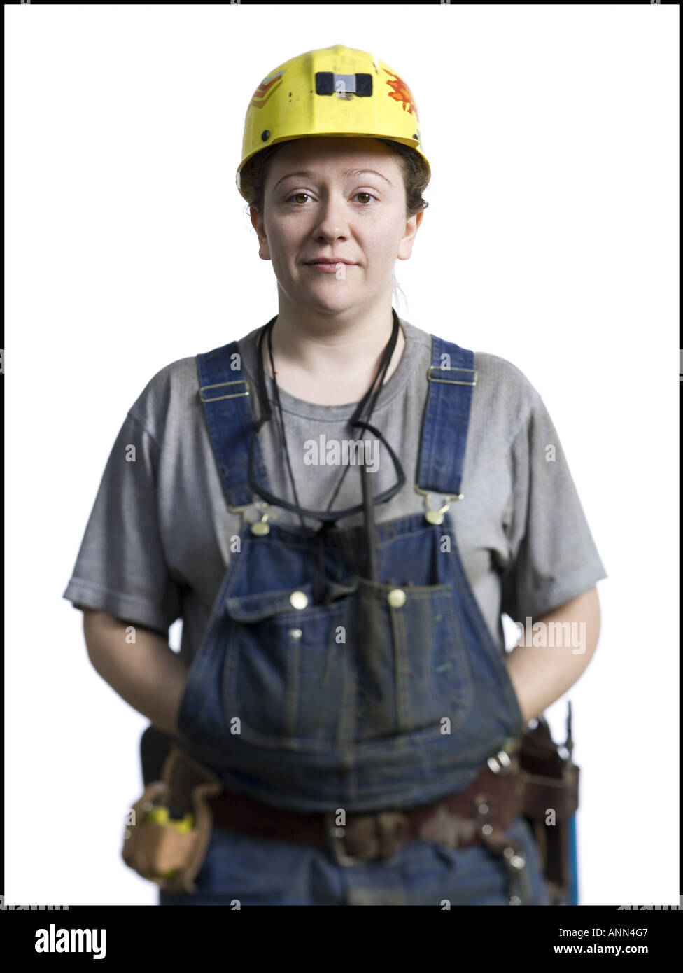 Portrait of a female coal miner standing with her hands in her pockets ...