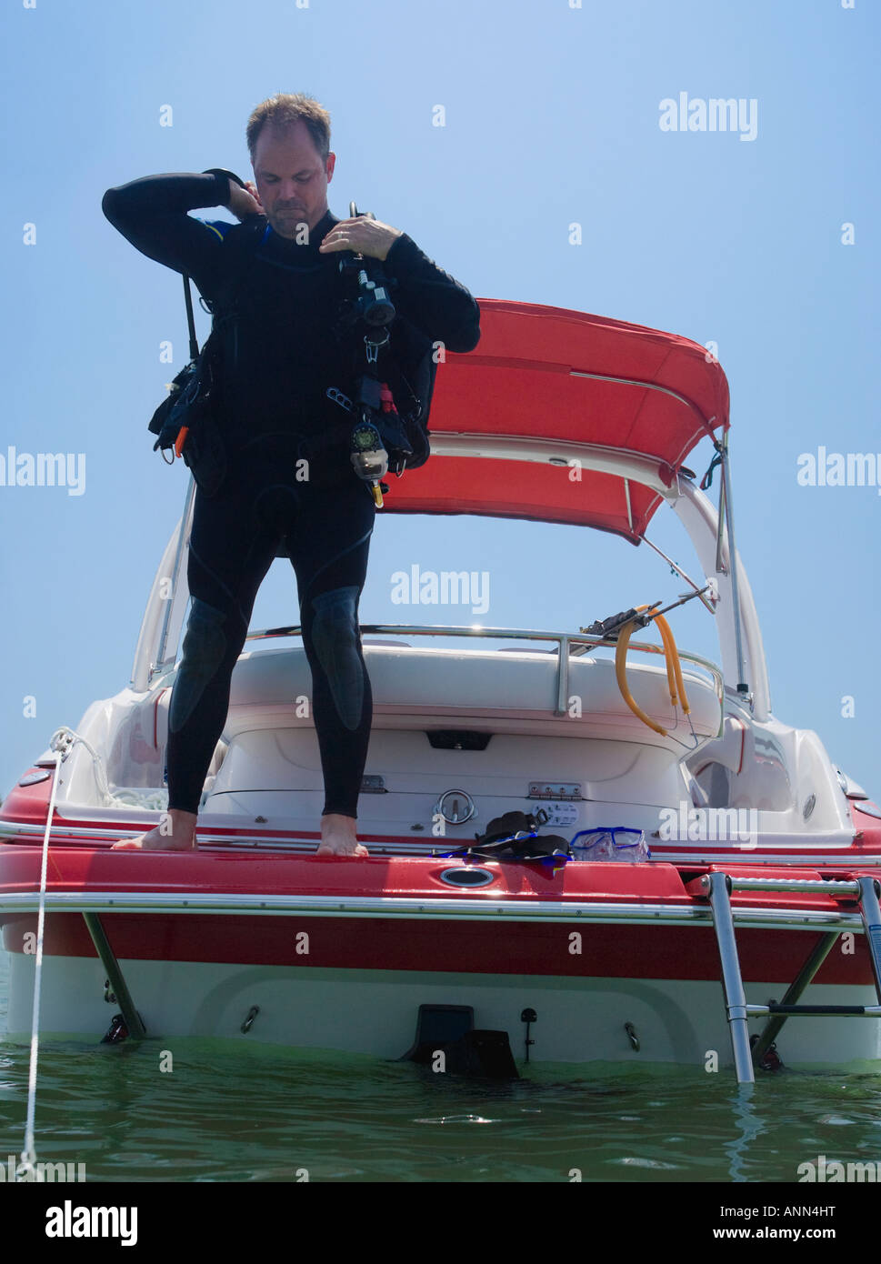 Man with scuba gear on boat, Florida, United States Stock Photo - Alamy