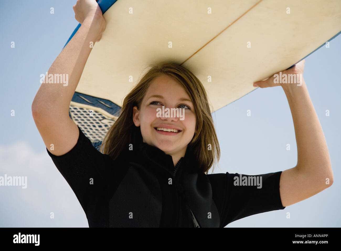 Girl surfboard wetsuit hi-res stock photography and images - Alamy